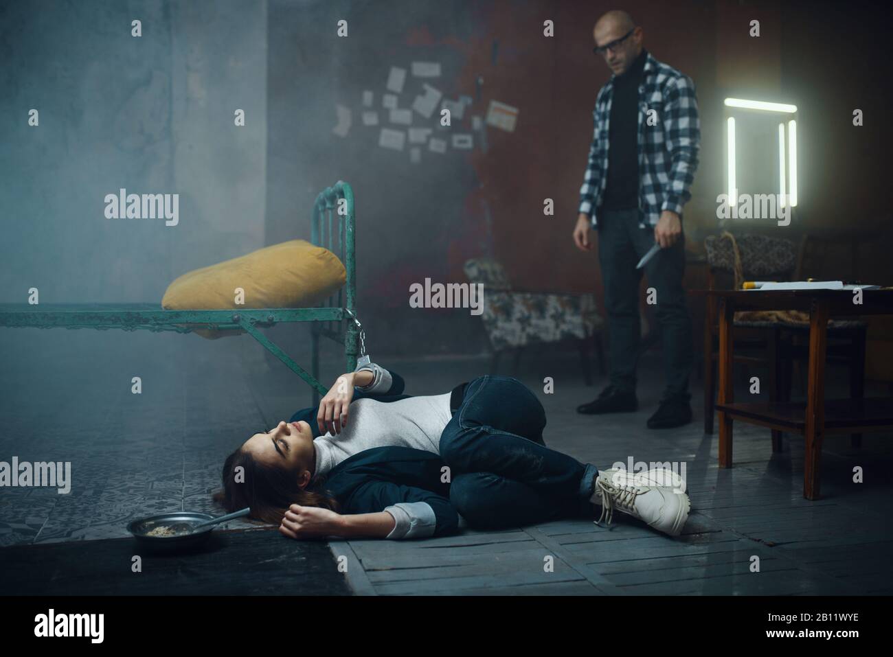 Maniac kidnapper smothers his scared hostage Stock Photo - Alamy