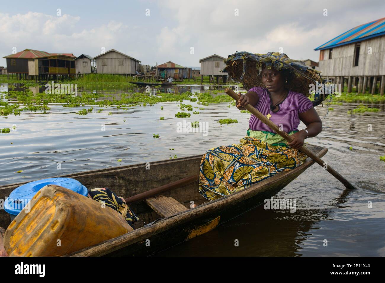 Residents of the floating village of Ganvié, Benin, Africa Stock Photo ...
