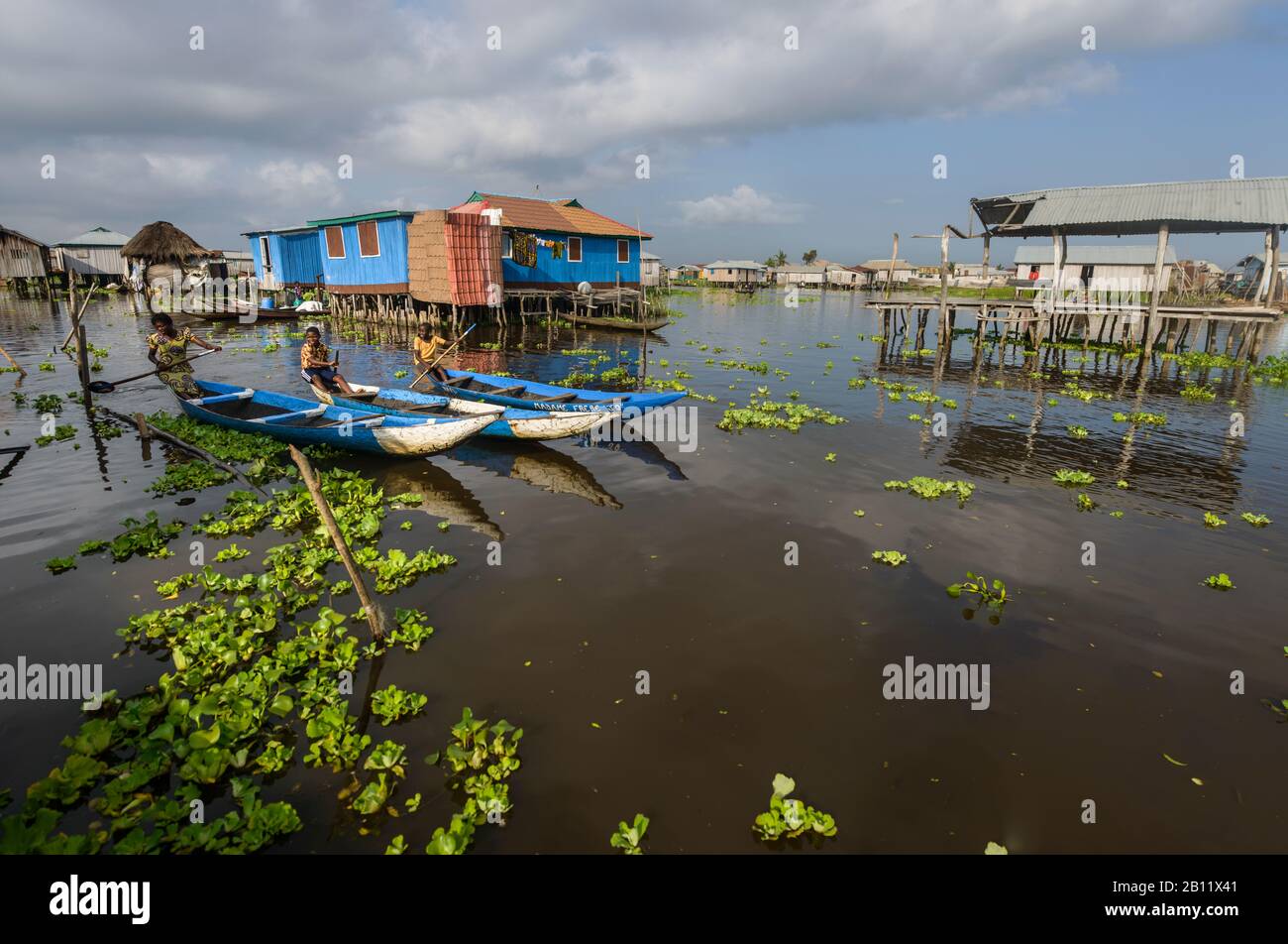 Residents of the floating village of Ganvié, Benin, Africa Stock Photo ...