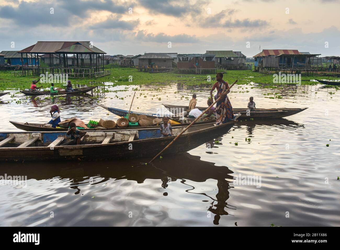 Residents of the floating village of Ganvié, Benin, Africa Stock Photo ...