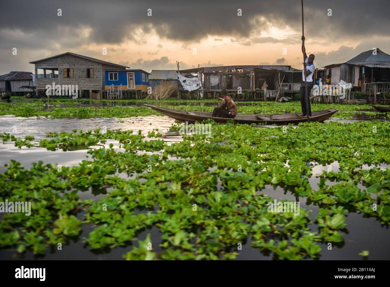Residents of the floating village of Ganvié, Benin, Africa Stock Photo ...