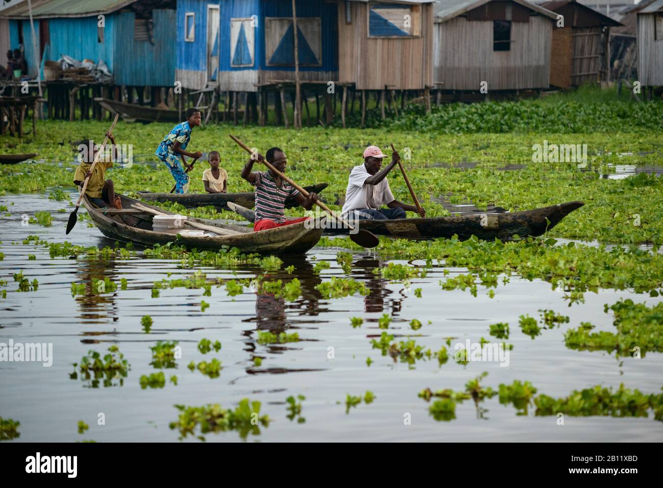 Residents of the floating village of Ganvié, Benin, Africa Stock Photo ...