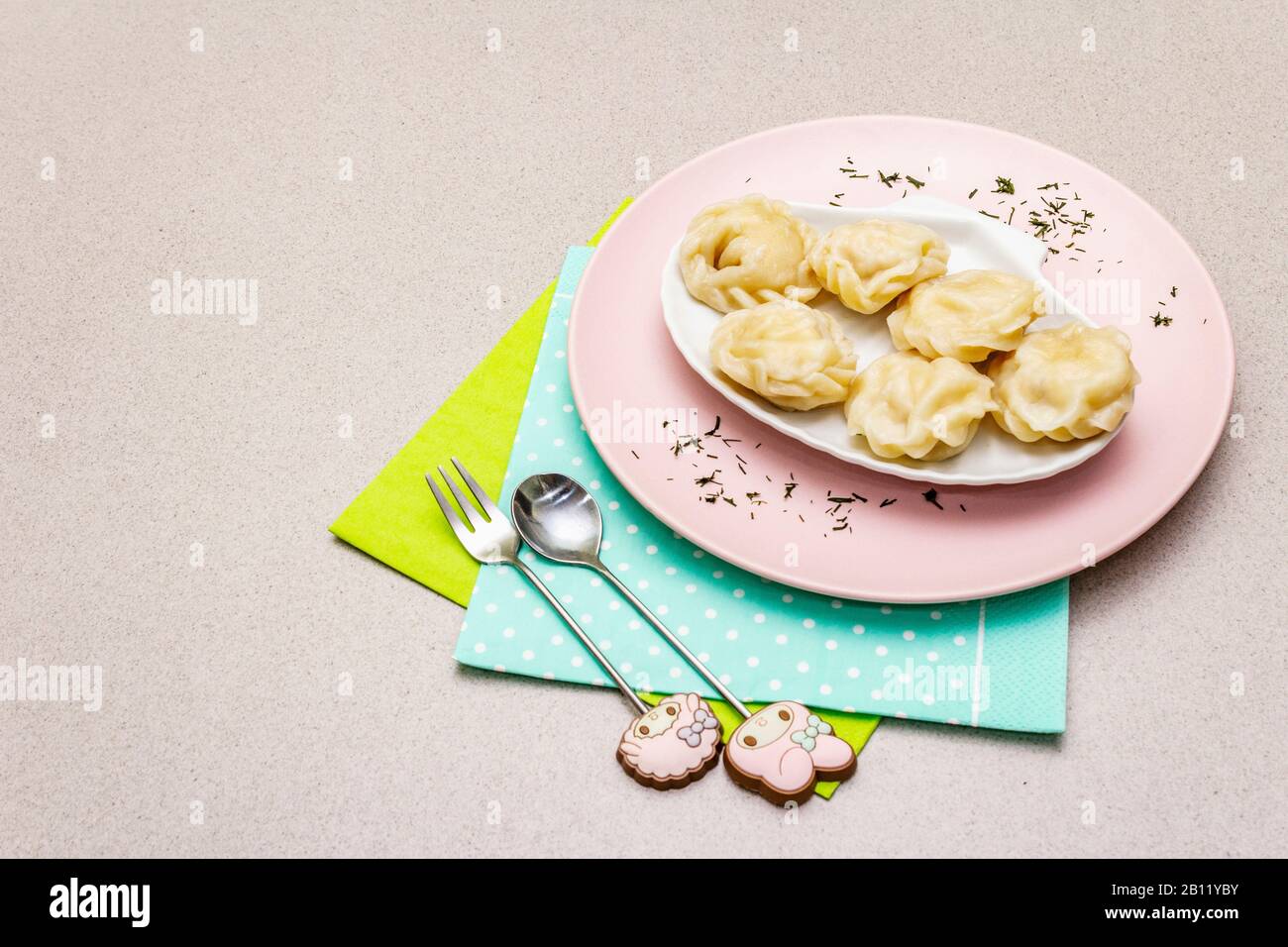 Fish dumplings. The concept of healthy food for children. Kids cutlery ...