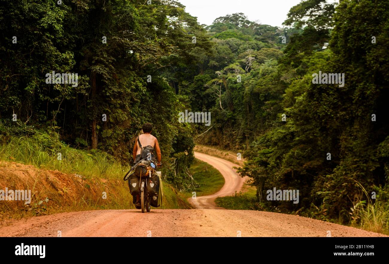 Cycling in Gabon's equatorial rainforest, Central Africa Stock Photo ...