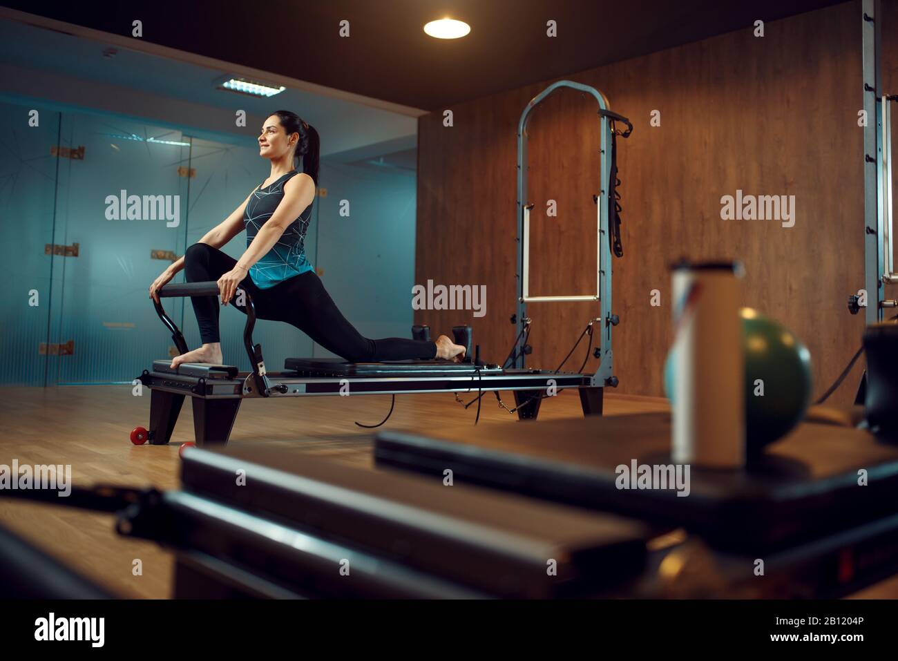 Slim girl keeps the balance, pilates training Stock Photo - Alamy