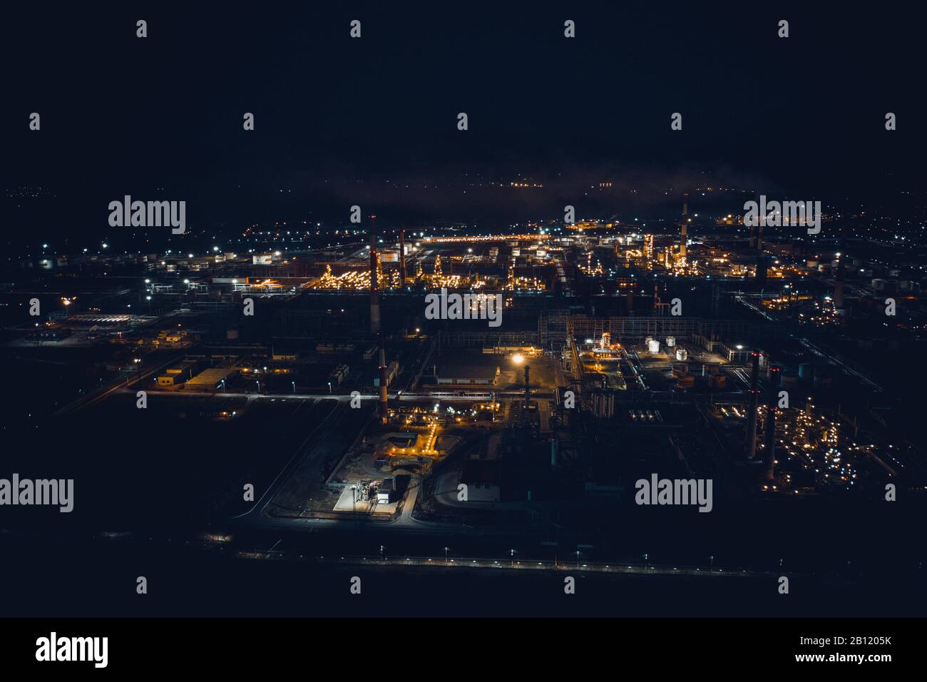 Oil refinery night Stock Photo - Alamy