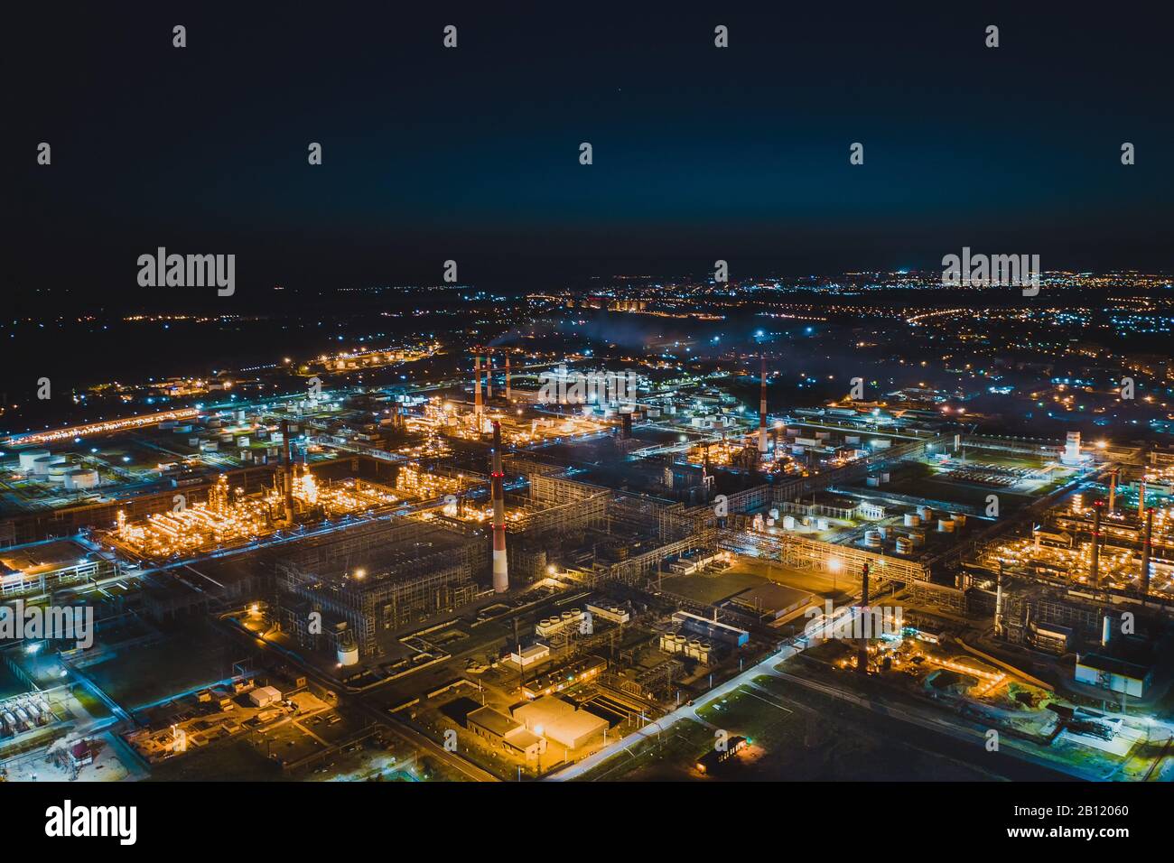 Oil refinery night Stock Photo - Alamy