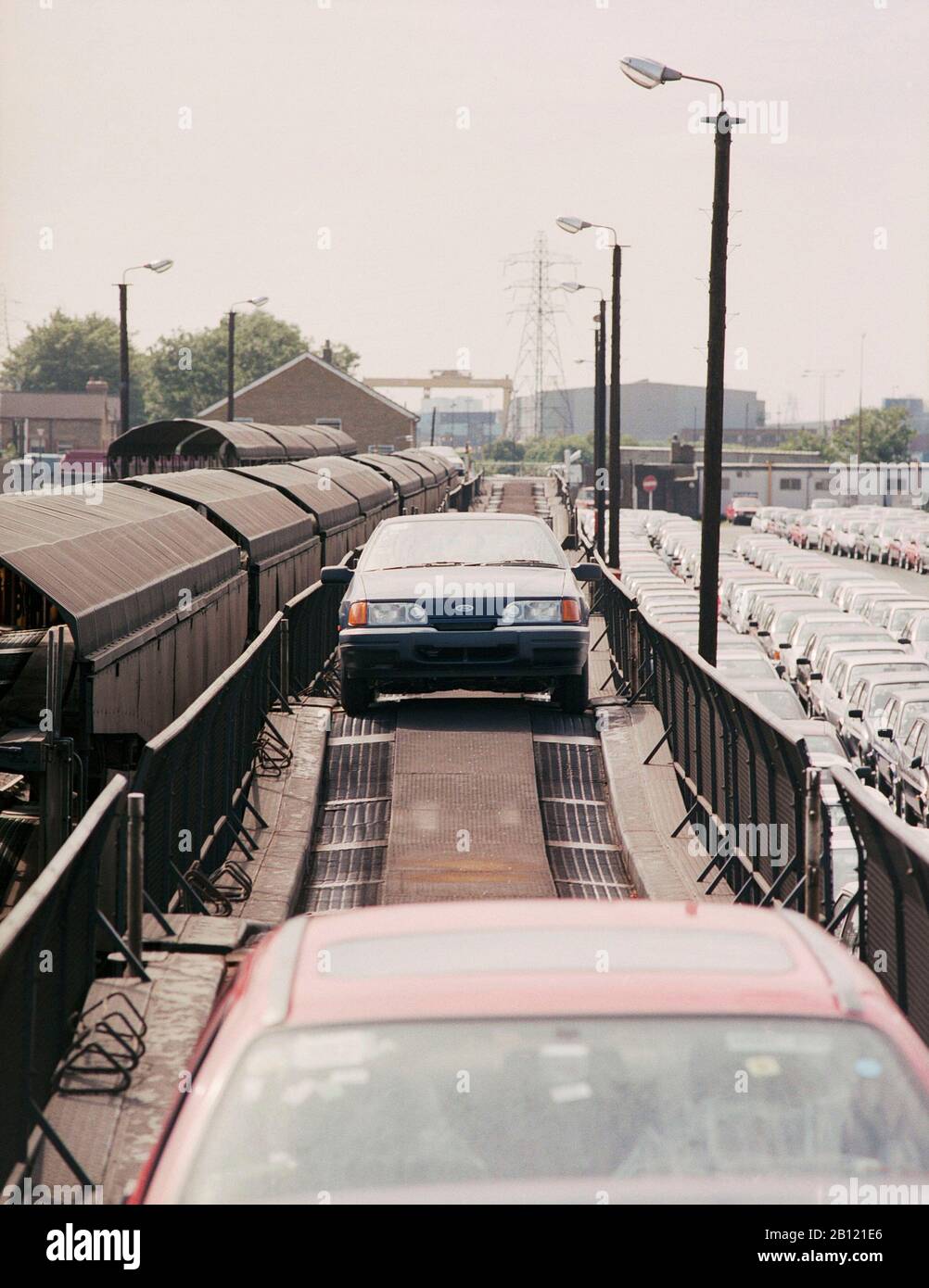 1987, Loading new cars onto rail transport at the Ford factory ...