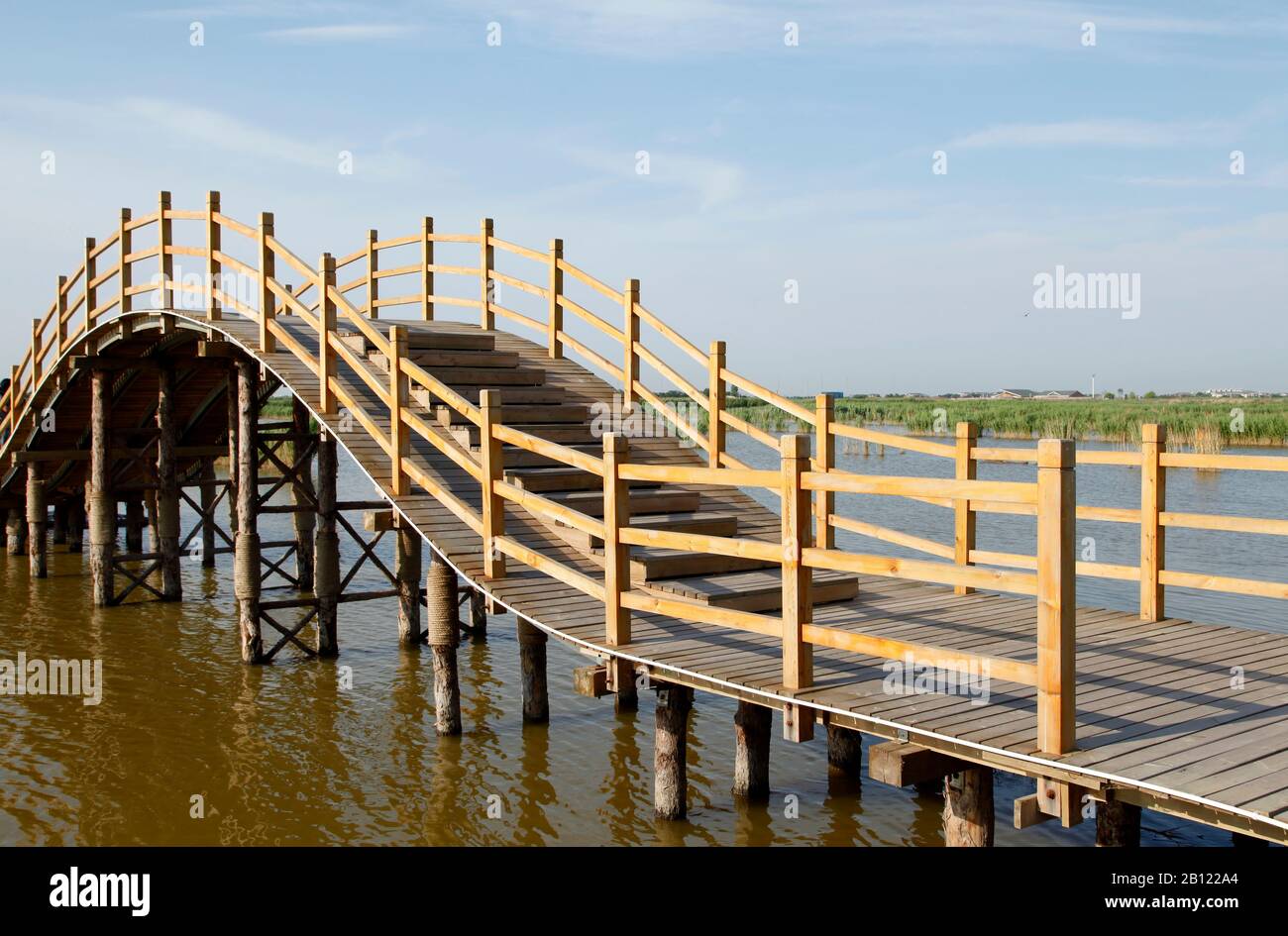 The wood bridge in wetland park Stock Photo - Alamy