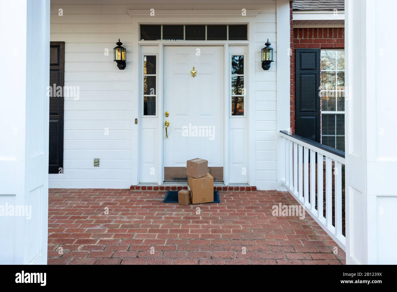 Packages on front porch of home Stock Photo - Alamy