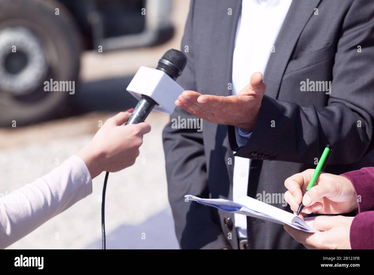 Reporters making media interview with business person or politician ...