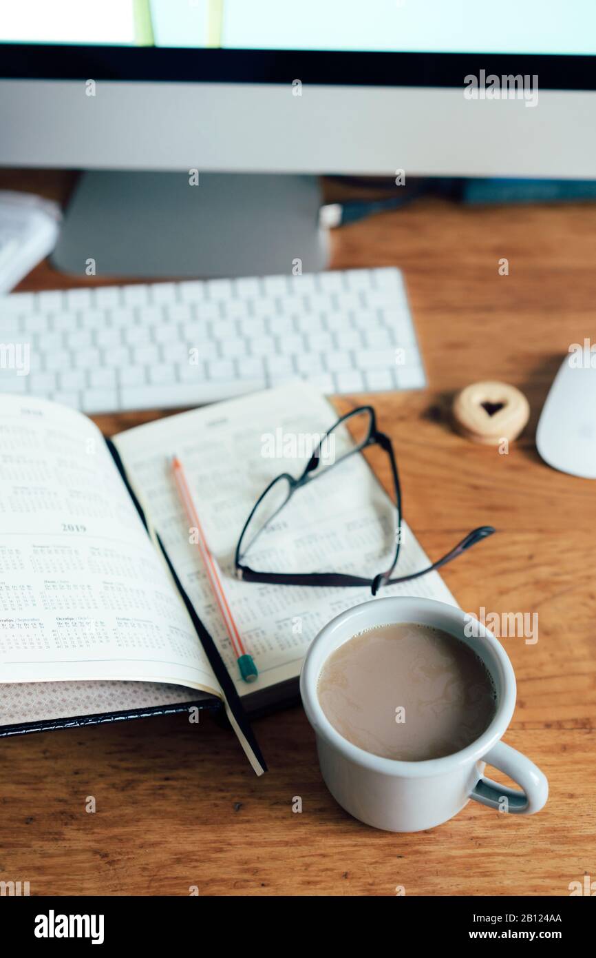 workplace calendar computer coffee Stock Photo - Alamy