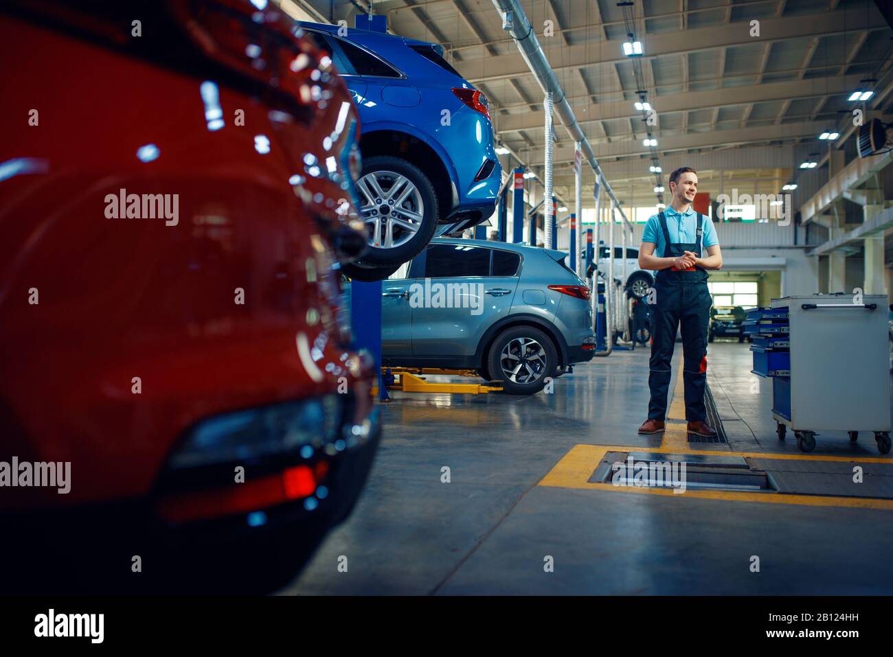 Man Lifts Car High Resolution Stock Photography and Images - Alamy