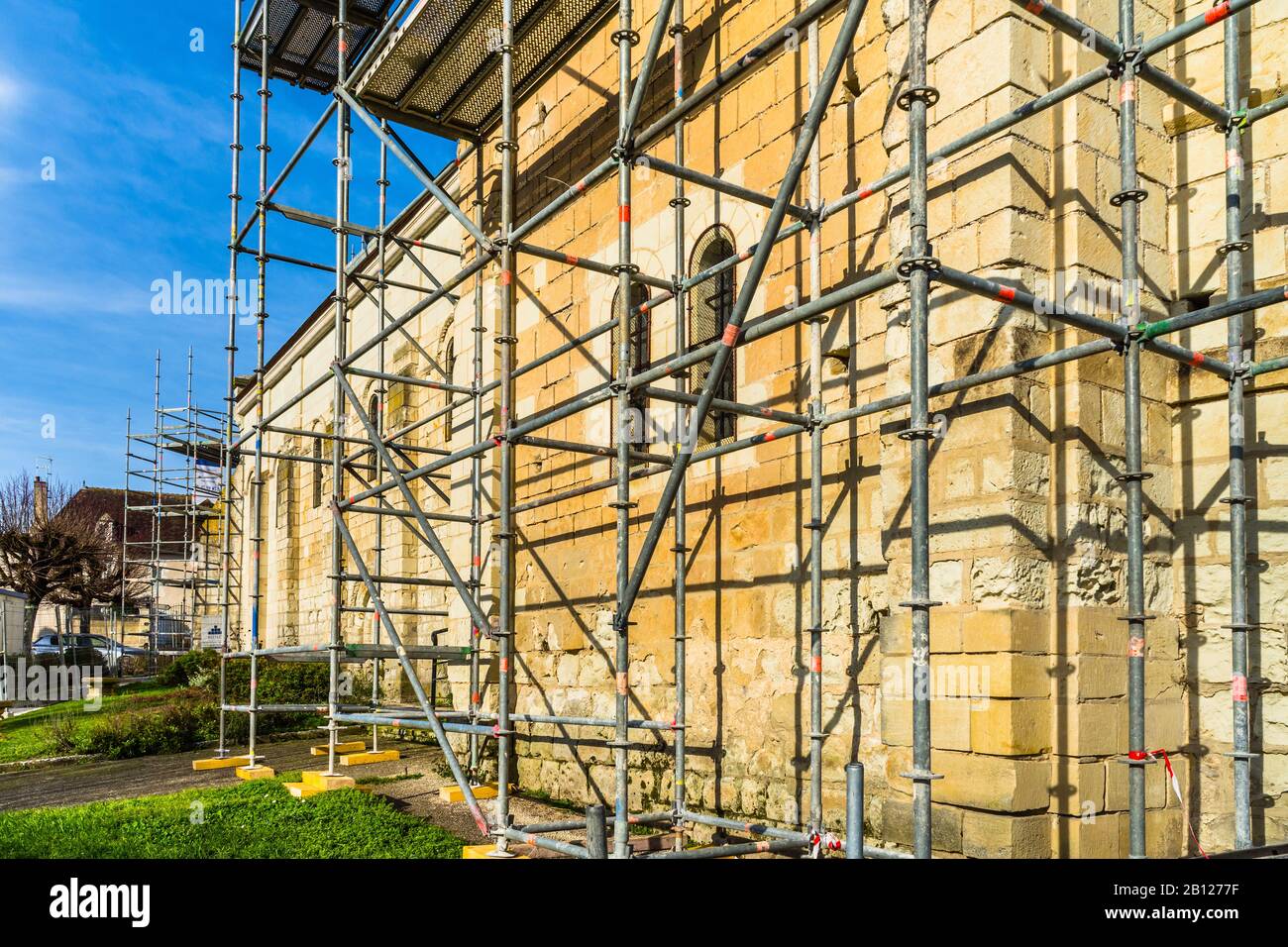 Modular scaffolding erected around old church for stone cleaning and ...