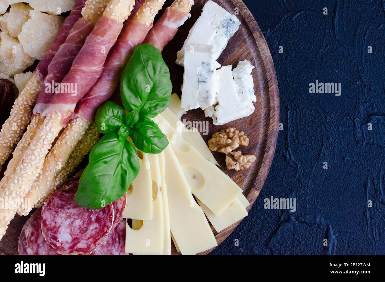 Wooden board full of mediterranean appetizers, tapas or antipasti ...