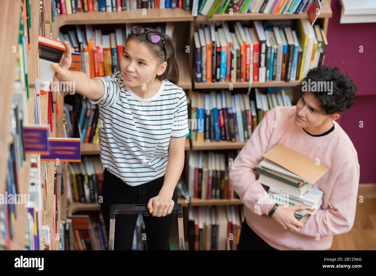 Person holding large book hi-res stock photography and images - Alamy