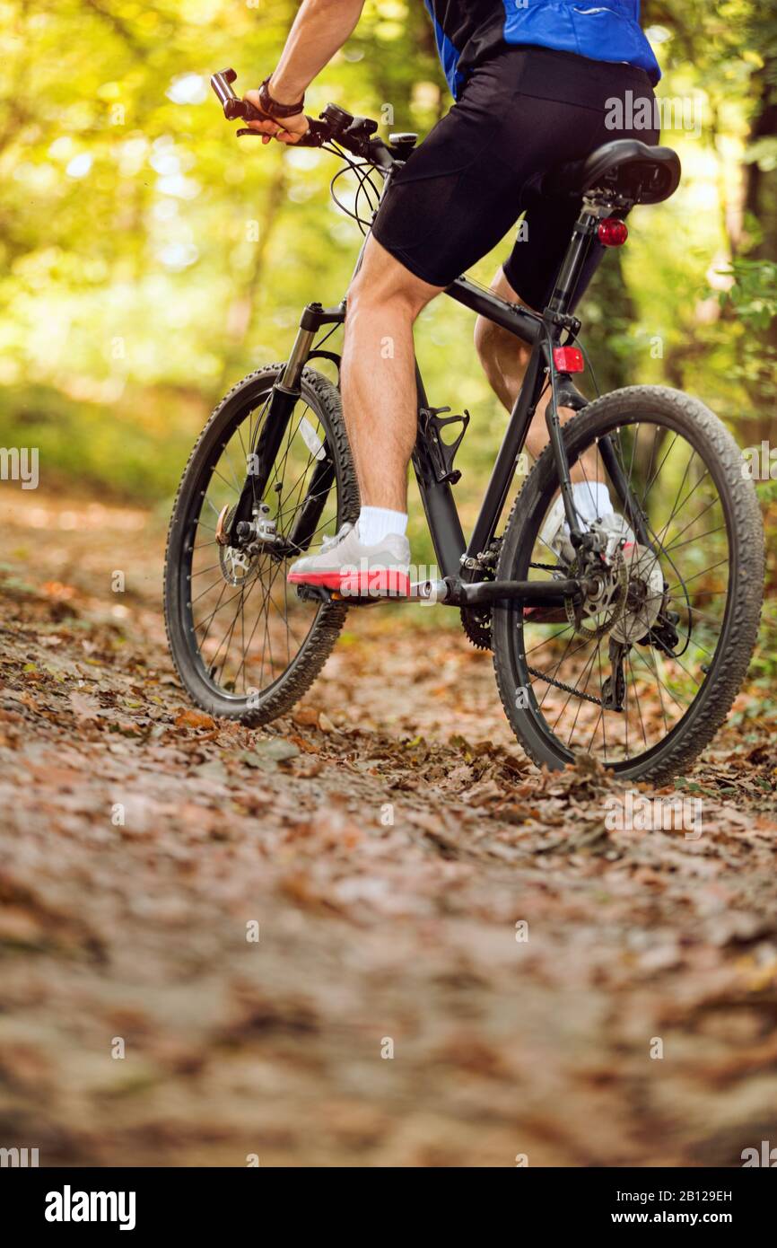 Legs man riding exercise bike hi-res stock photography and images - Alamy
