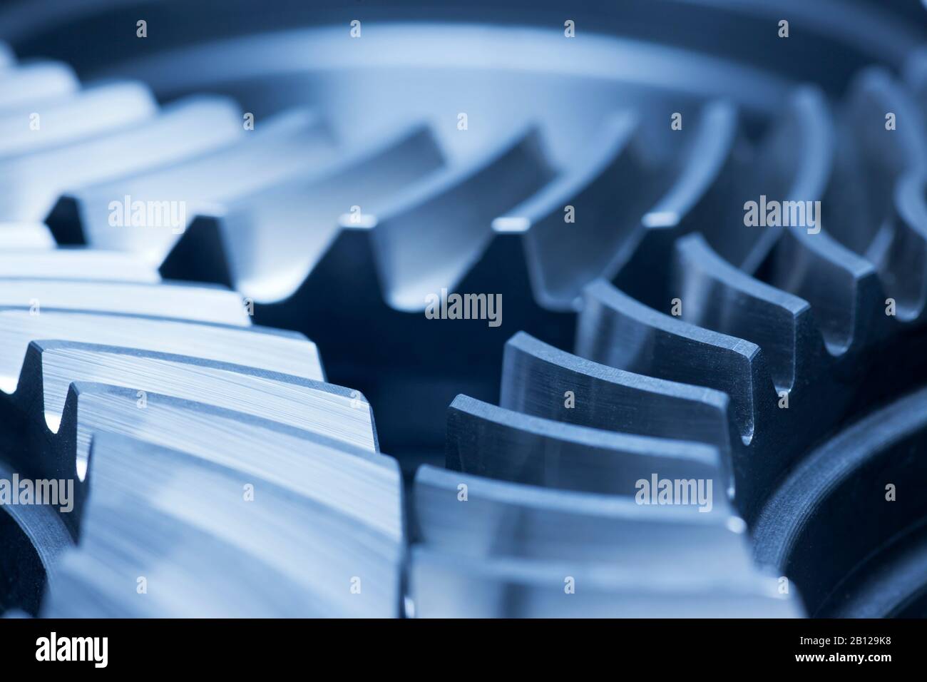 Three cog wheels working together in an engine Stock Photo - Alamy