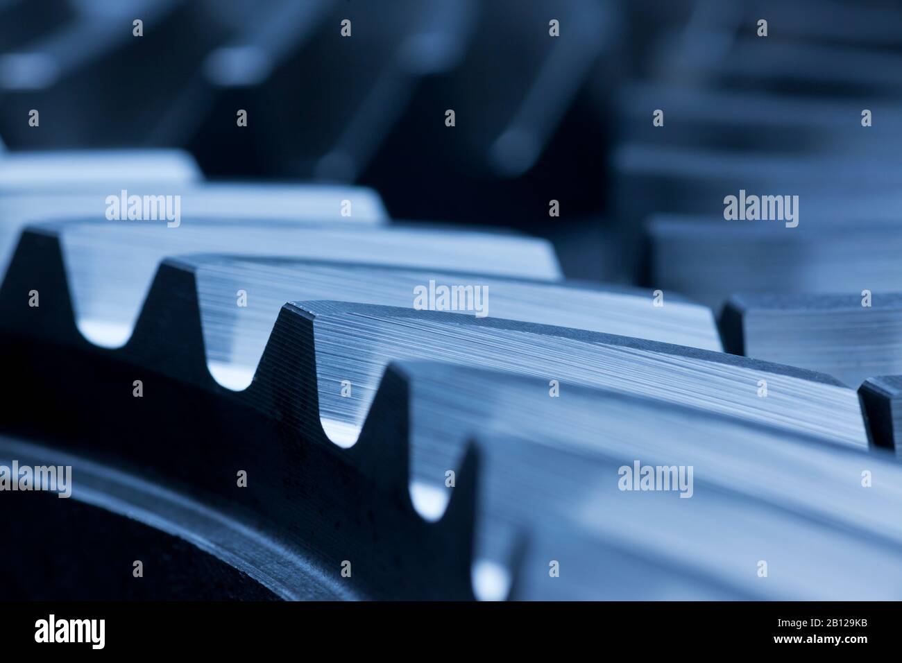 Three cog wheels working together in an engine Stock Photo - Alamy