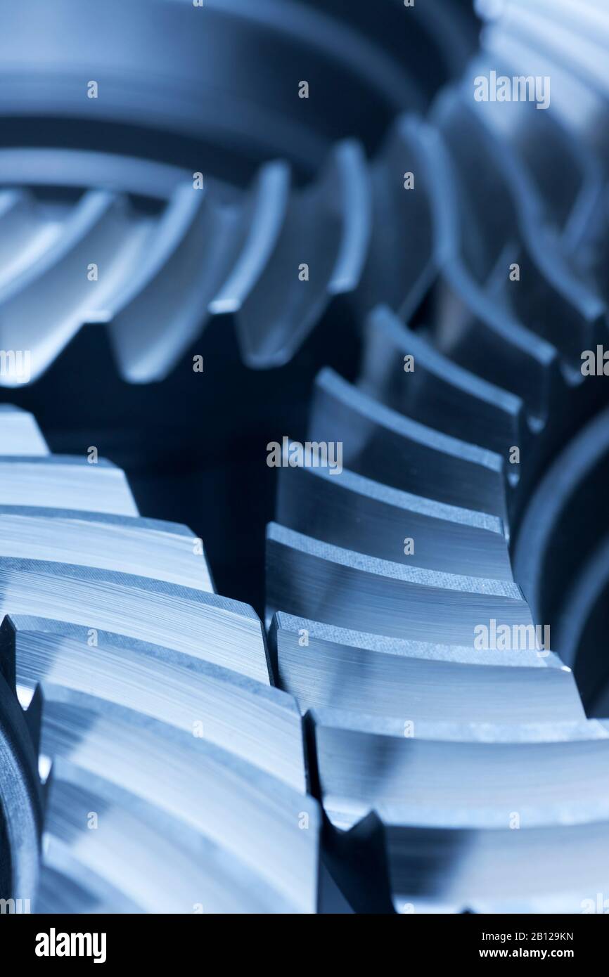 Three cog wheels working together in an engine Stock Photo - Alamy