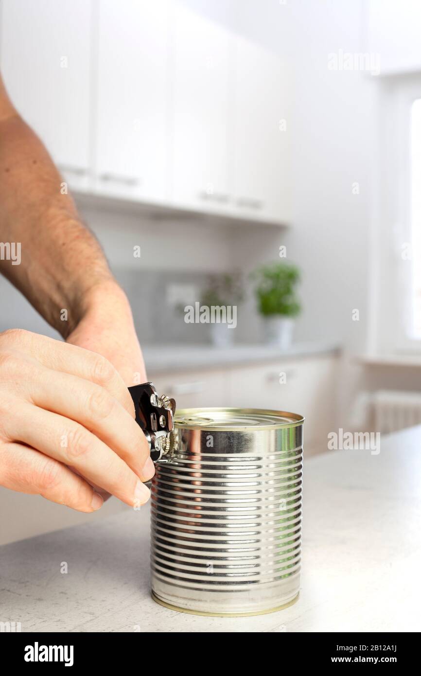 Tin can in hands hi-res stock photography and images - Alamy