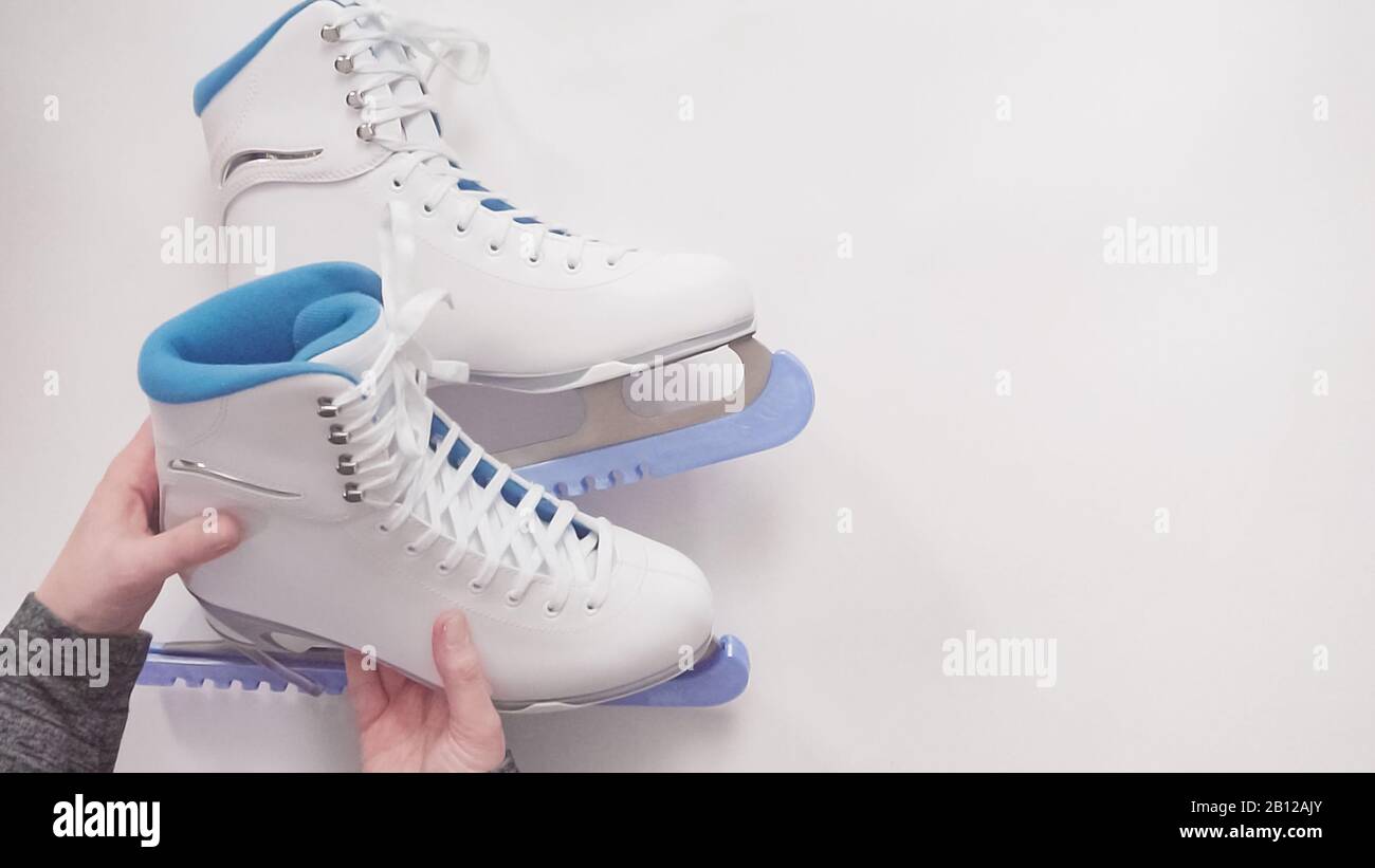 Flat lay. New figure skates on a white background Stock Photo - Alamy