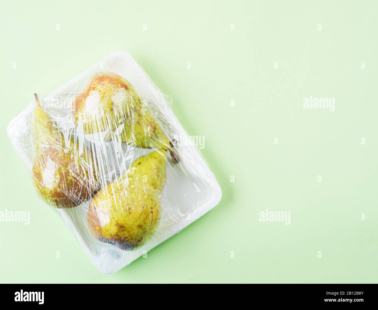 Fresh produce wrapped in plastic film Stock Photo - Alamy