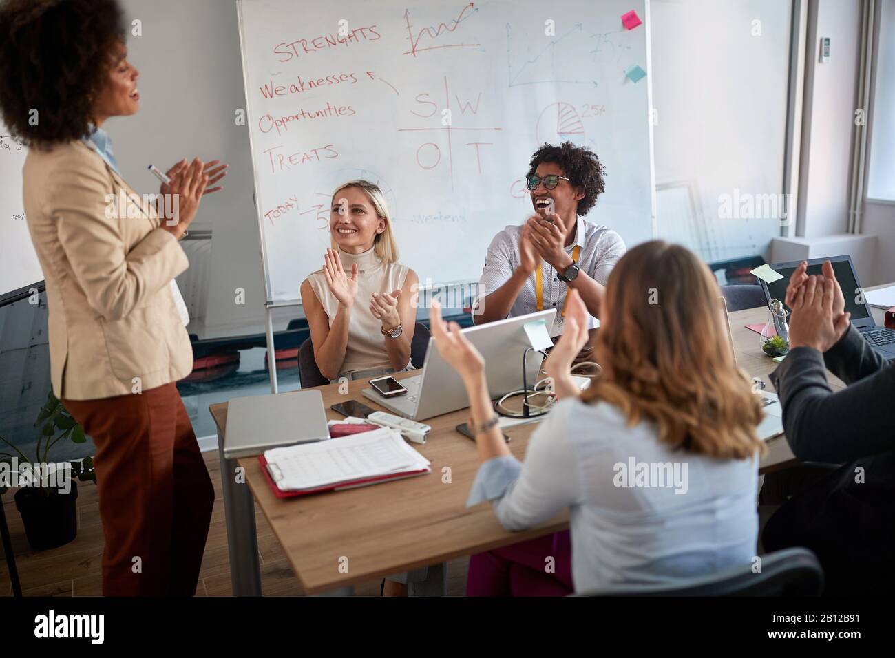 Business people clapping after presentation hi-res stock photography ...