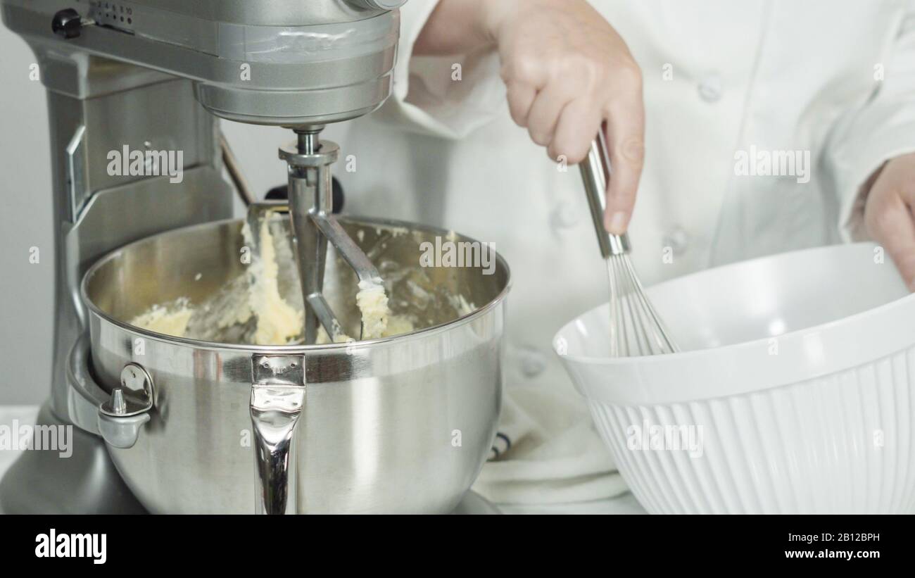 Step by step. Mixing ingredients in standing kitchen mixer to bake ...