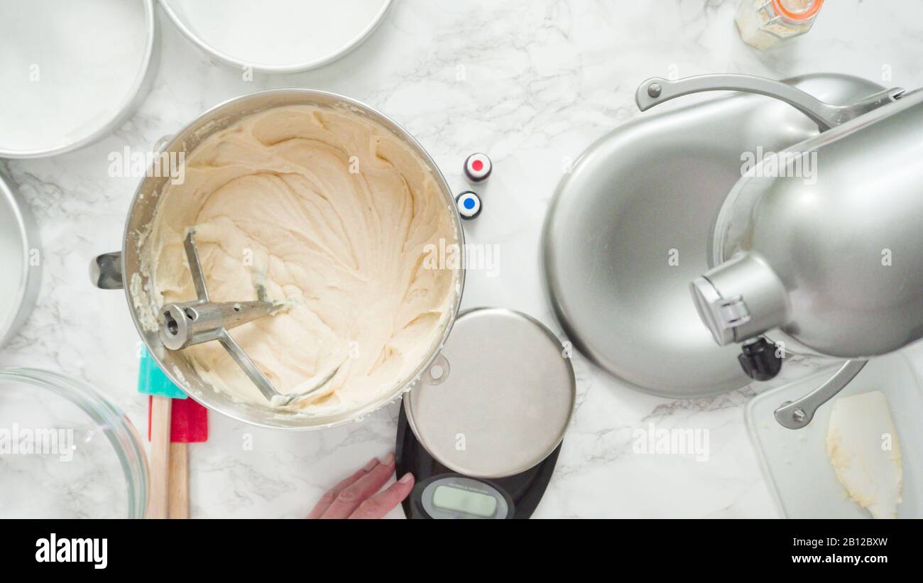 Step by step. Flat lay. Measuring cake batter with a digital kitchen ...