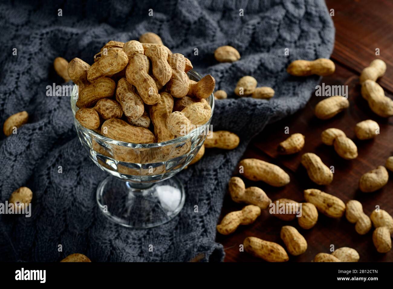 Peanuts in a bowl on a dark background. Peanuts in a shell. Healthy ...