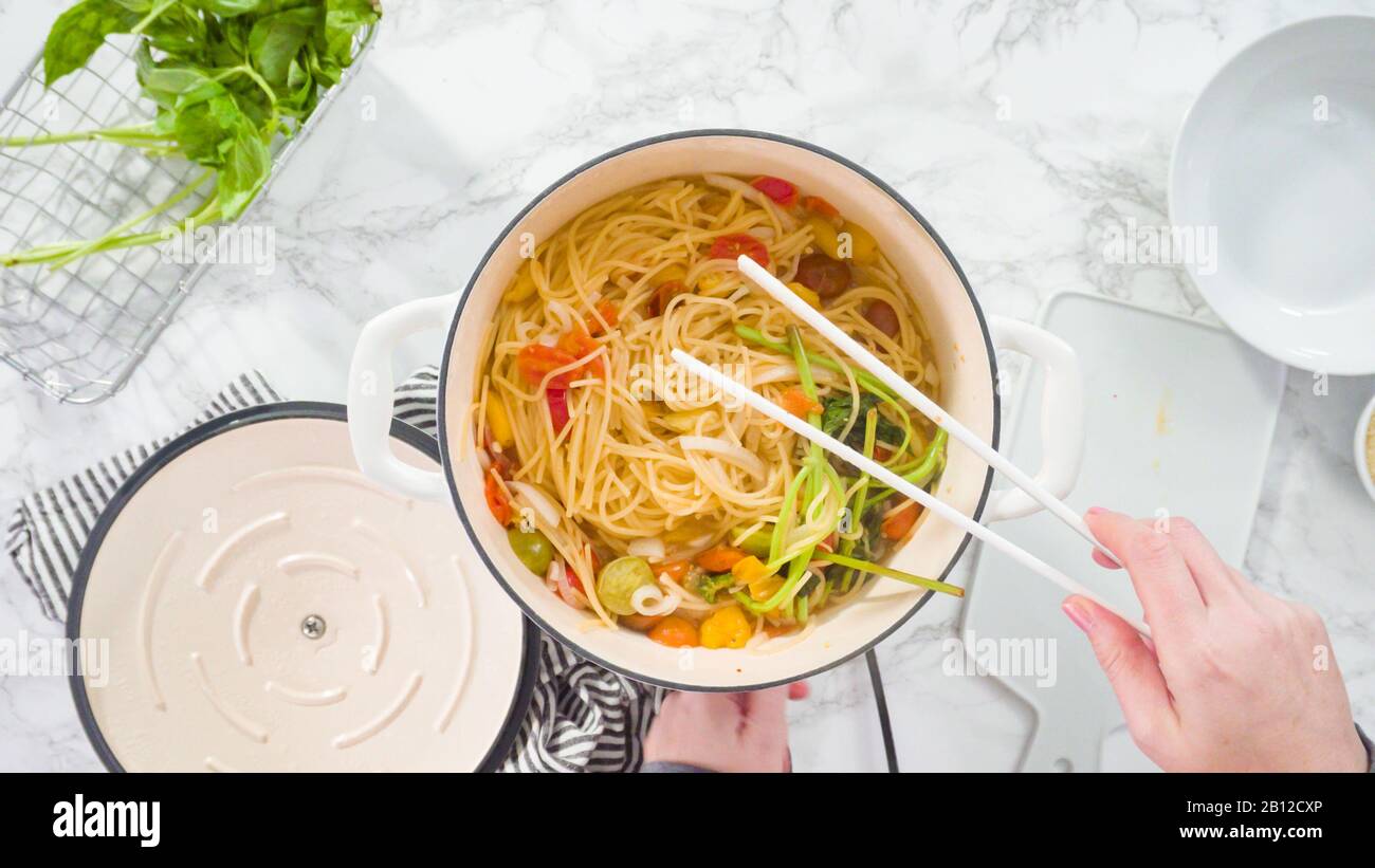 Flat lay. Step by step. Cooking on pot pasta recipe in an enameled cast ...