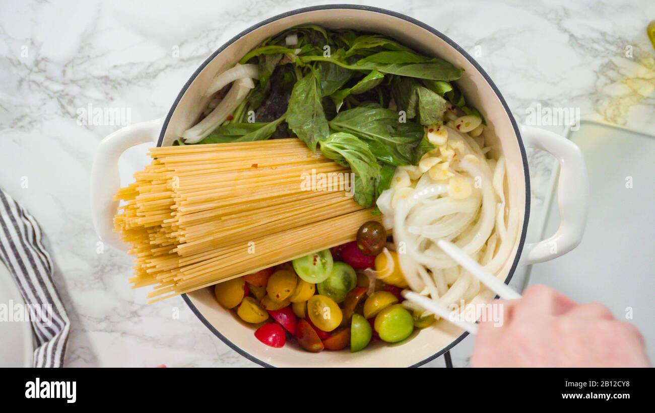 Flat lay. Step by step. Cooking on pot pasta recipe in an enameled cast ...