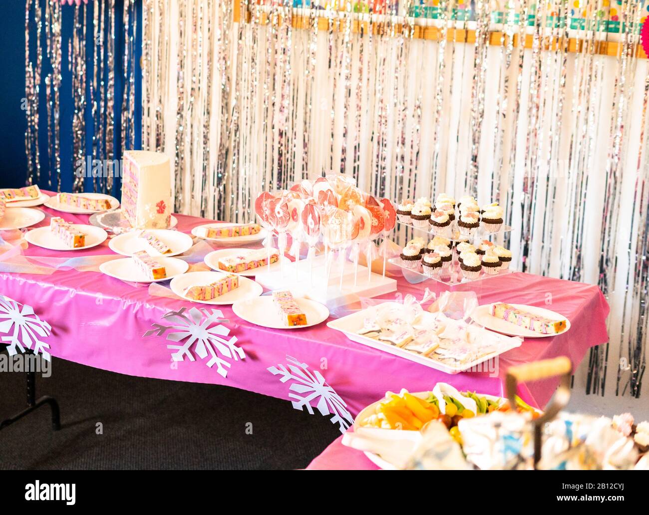 Table with cake and desserts at the little girl's birthday party Stock ...