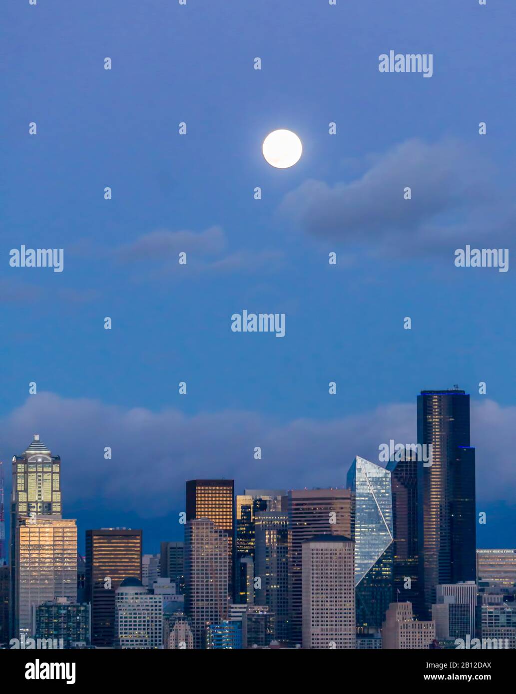A bright full moon shines over the Seattle skyline Stock Photo - Alamy