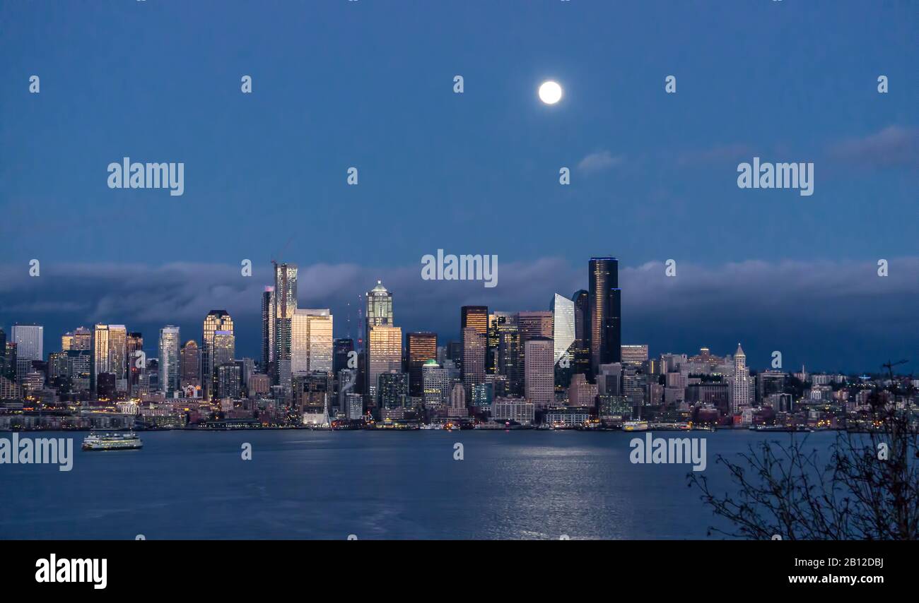 A bright full moon shines over the Seattle skyline Stock Photo - Alamy