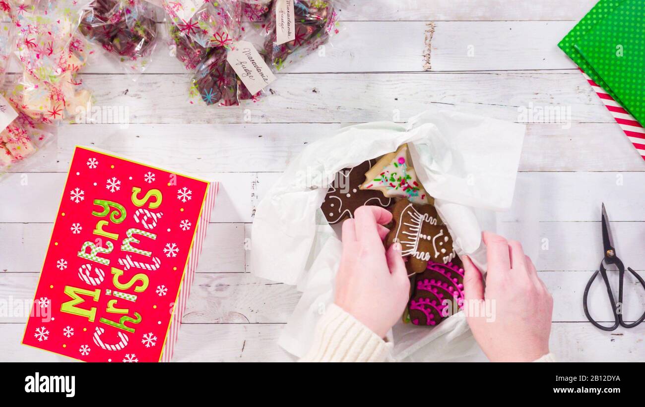 Flat lay. Step by step. Packaging homemade fudge and cookies into a ...