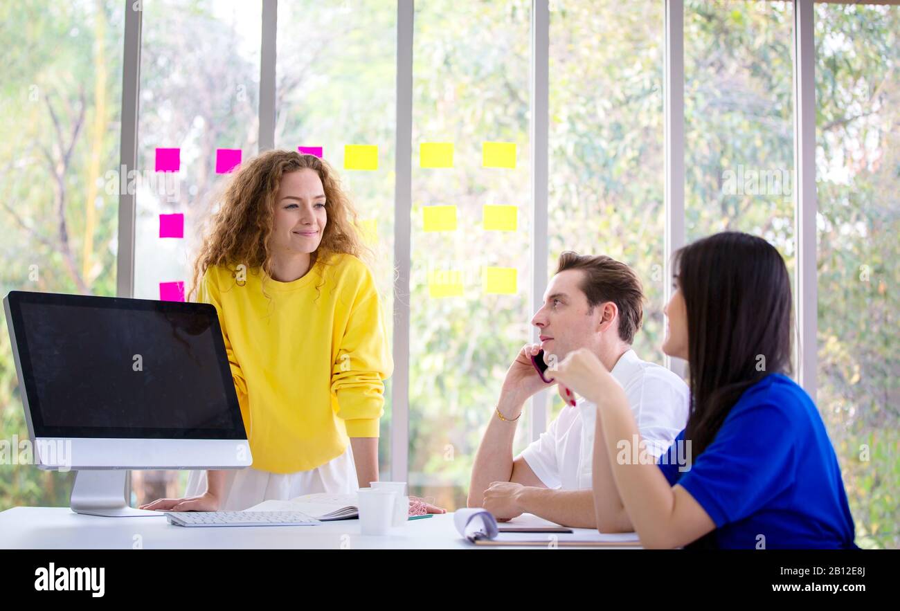 Full concentration at work. Group of young business people working and ...
