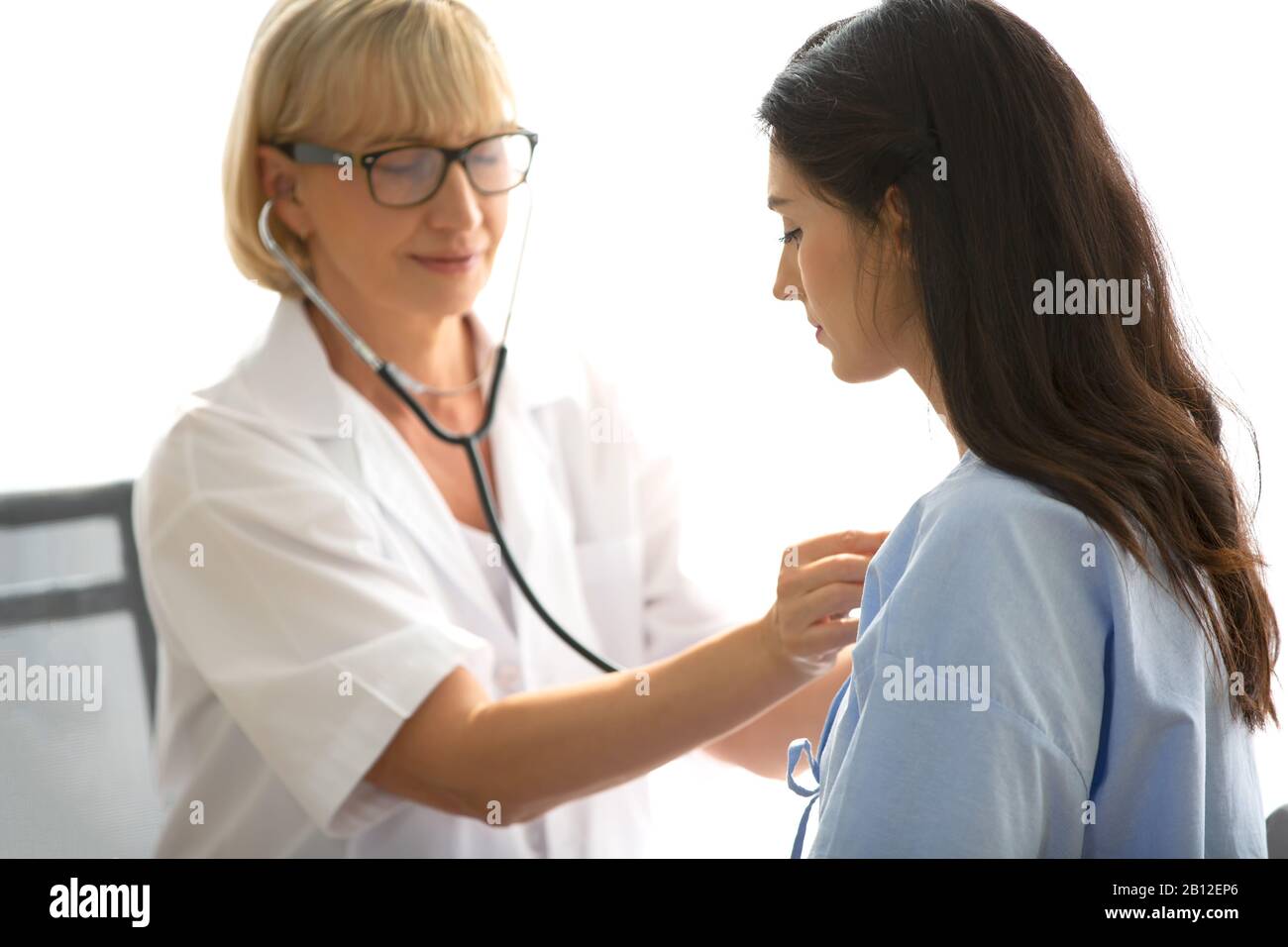 Women Doctor check up women patient in her office at hospital Stock ...