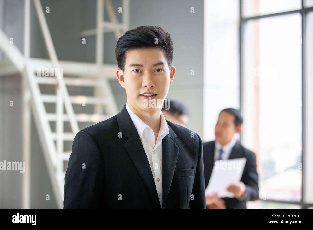 Handsome young asian man standing hi-res stock photography and images ...
