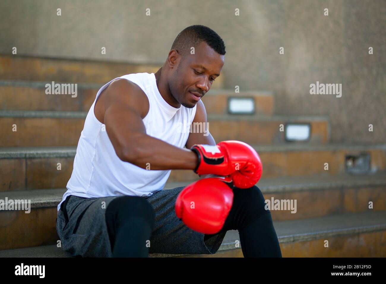 black skin boxer wearing red gloves on step Stock Photo - Alamy