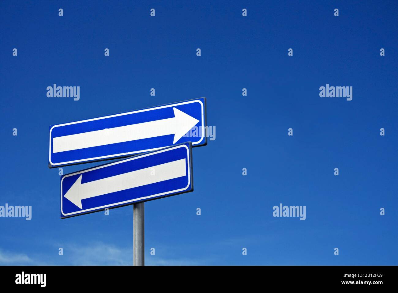 sign double way - blue sky Stock Photo - Alamy