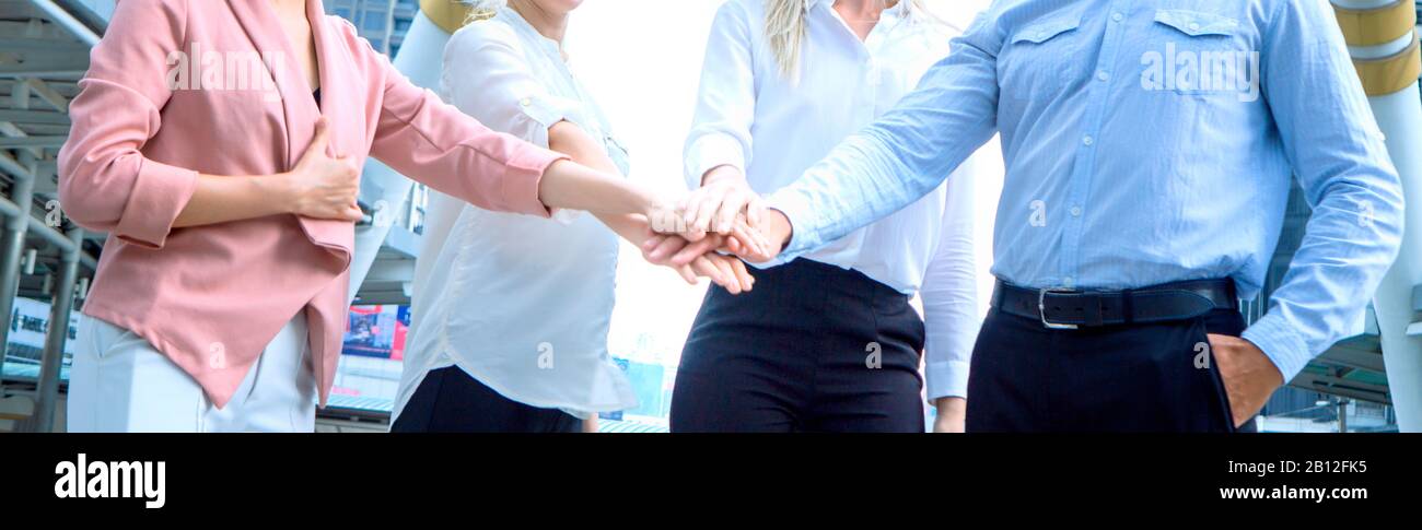 Close up and low angle view on hands of business people join together ...