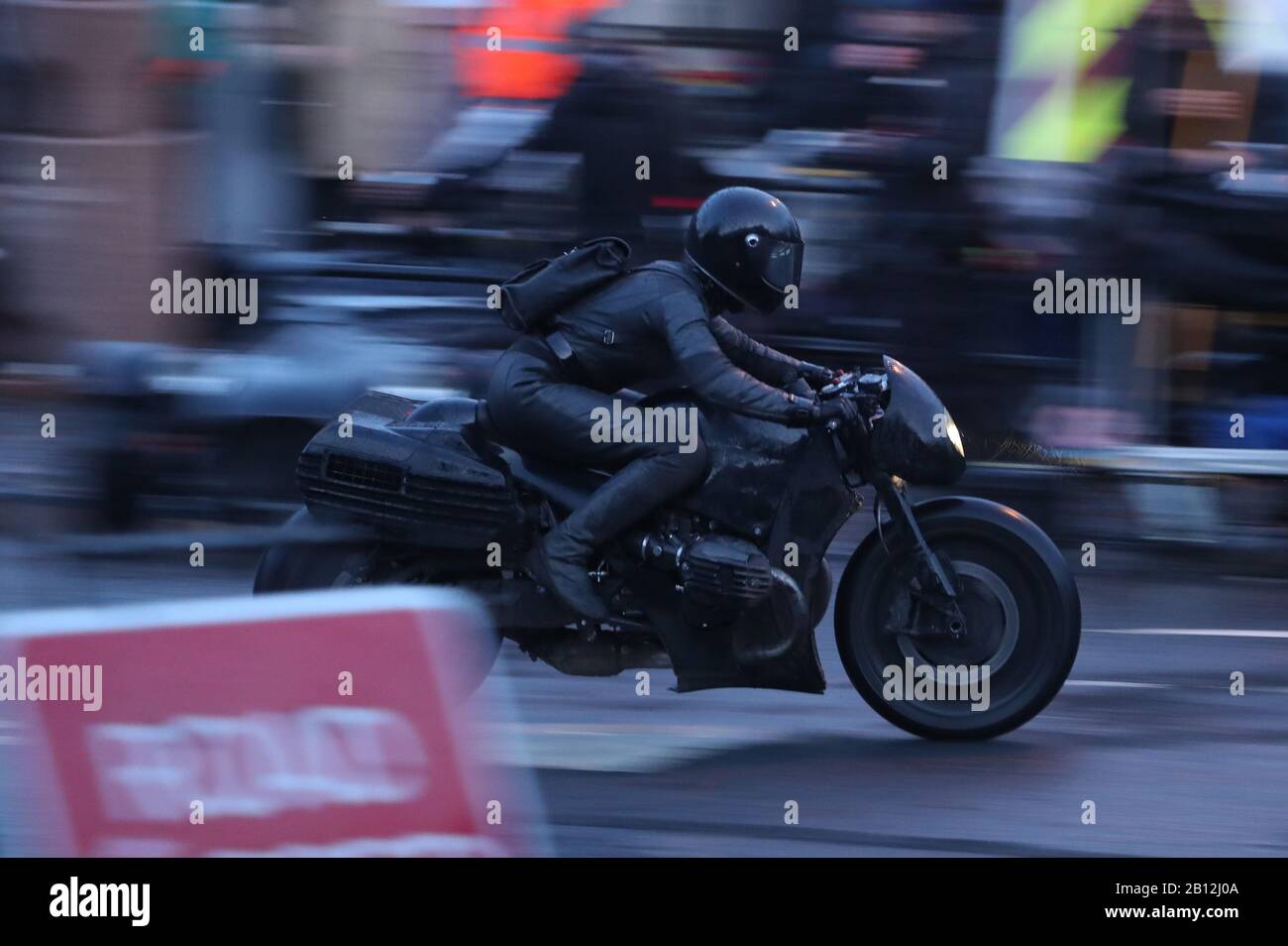 A person rides a motorcycle as filming continues in Glasgow for a new ...