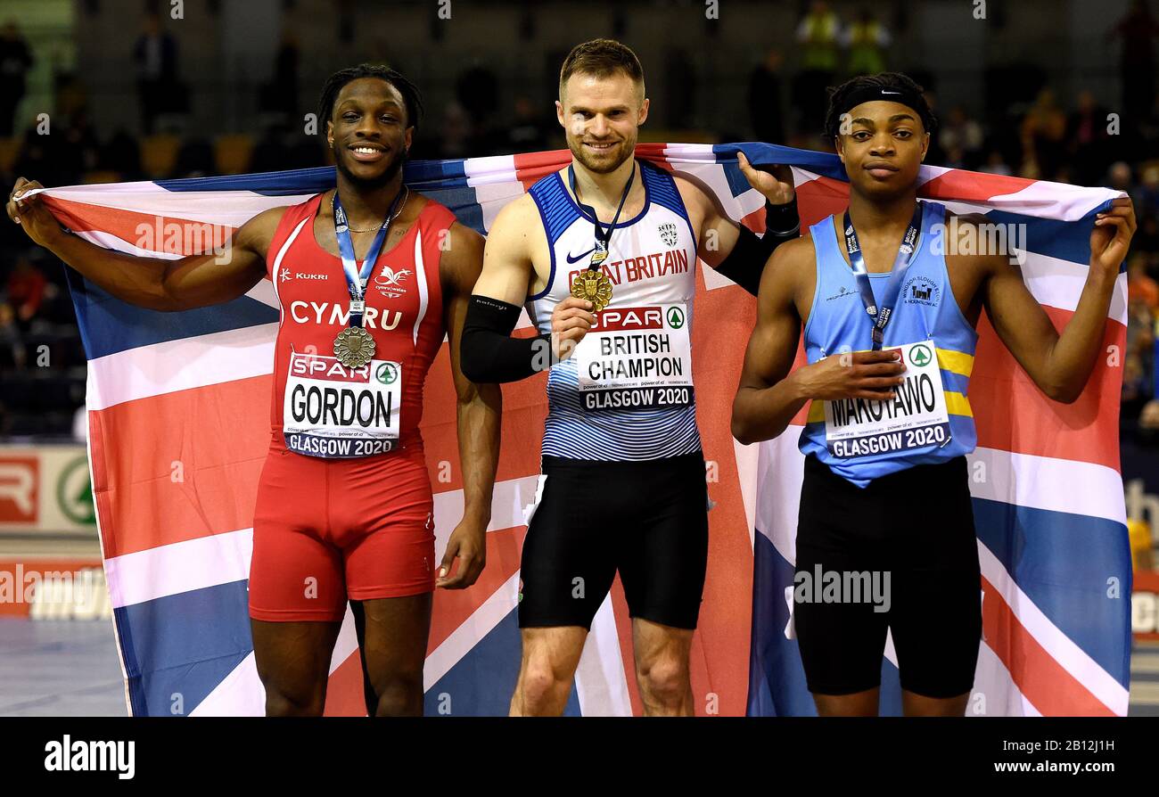Andrew Robertson (centre) celebrates with his gold medal after winning ...