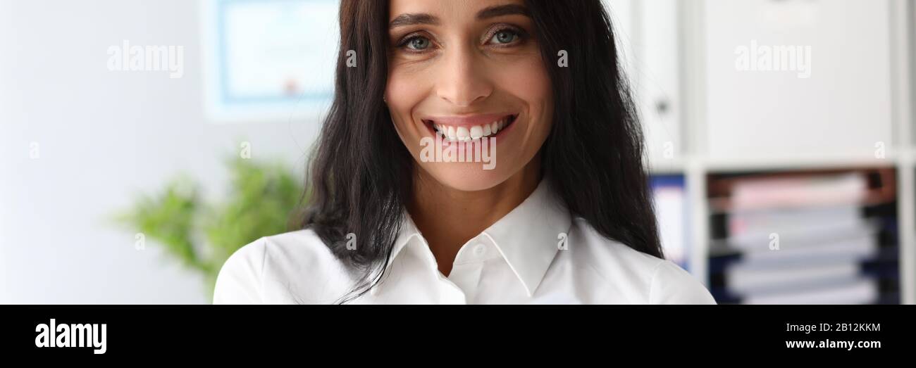 Smiling business lady in office Stock Photo - Alamy
