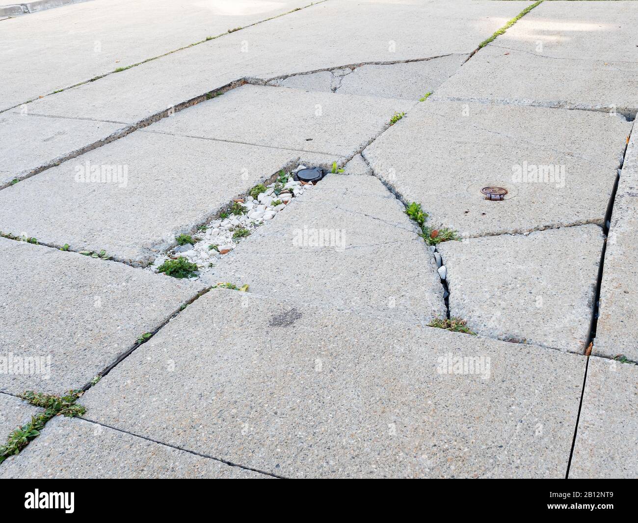Close-up photo of gray bitumen slabs with deep cracks Stock Photo - Alamy