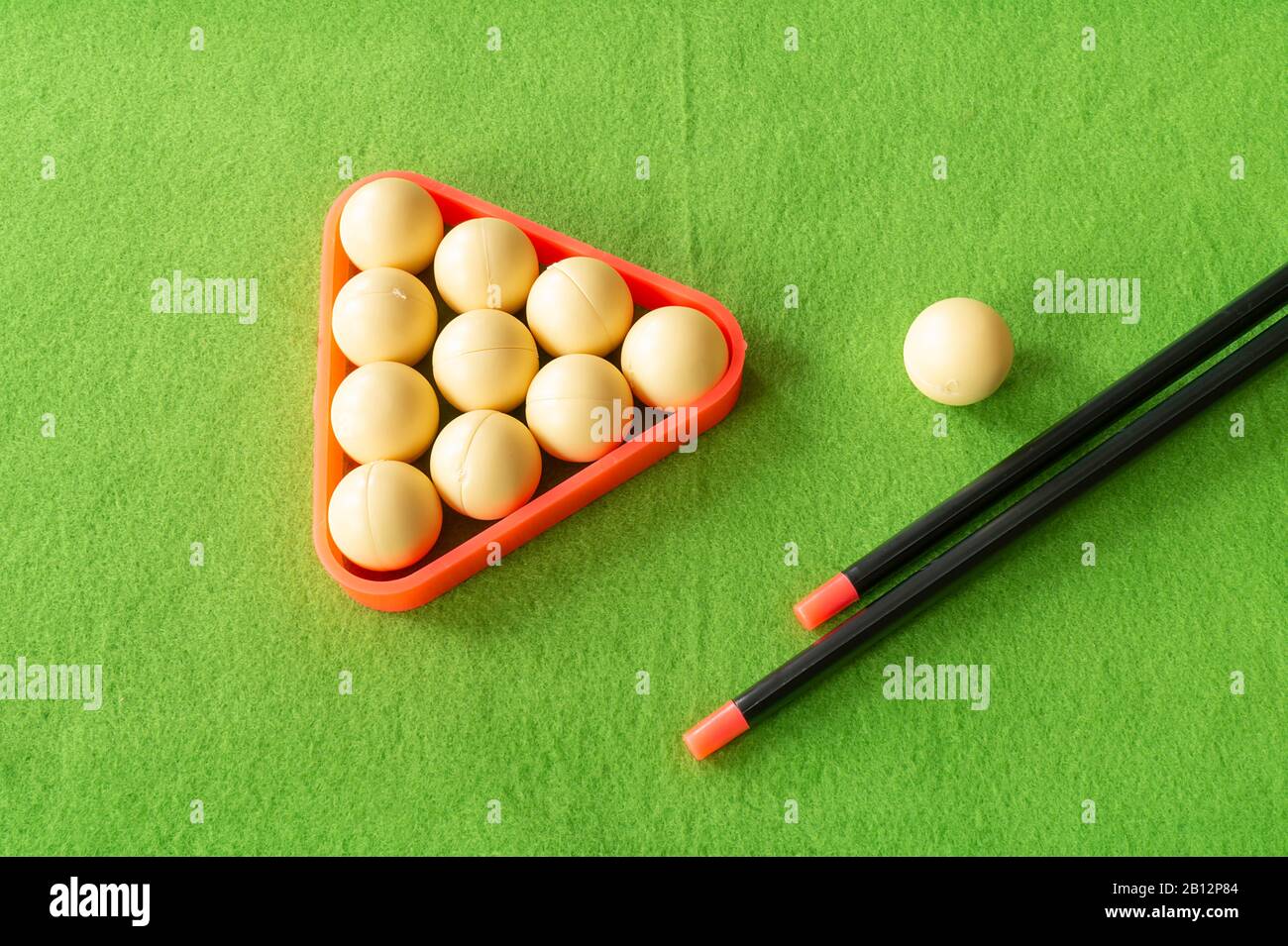 The Cue with ball on green table for game of billiards. Atheletic and ...