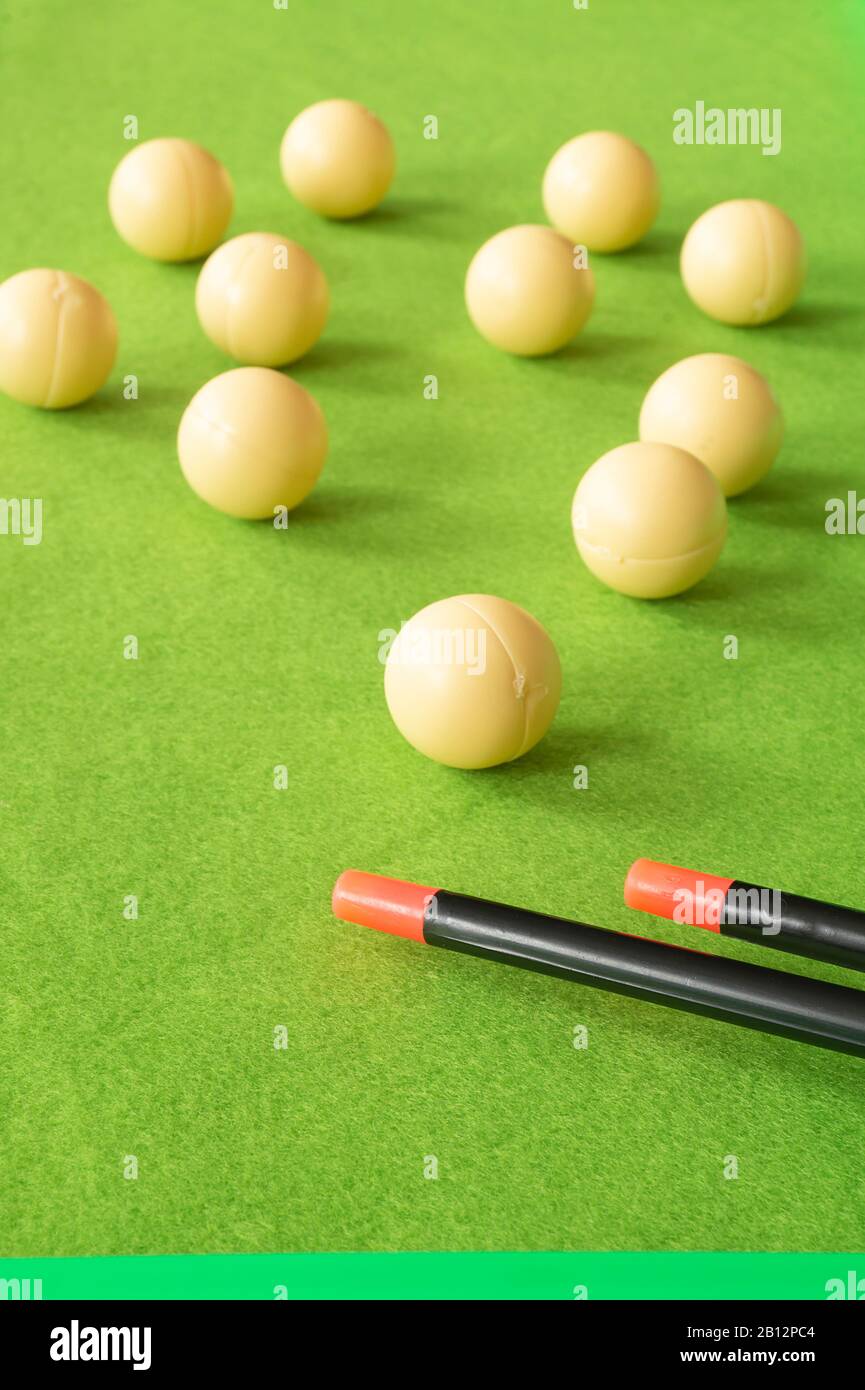 The Cue with ball on green table for game of billiards. Atheletic and ...