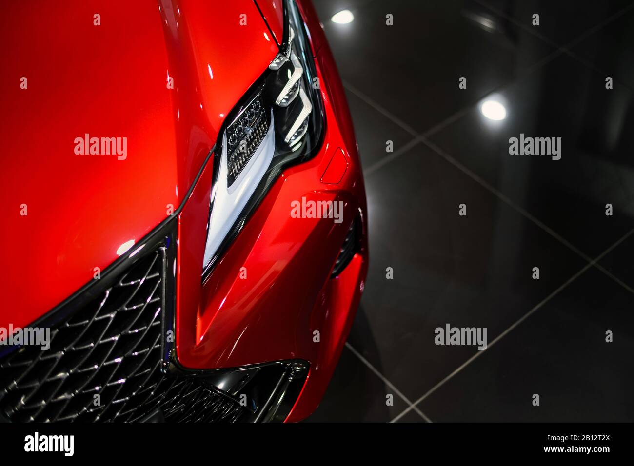 Brand new red Lexus RC car in the showroom Stock Photo - Alamy